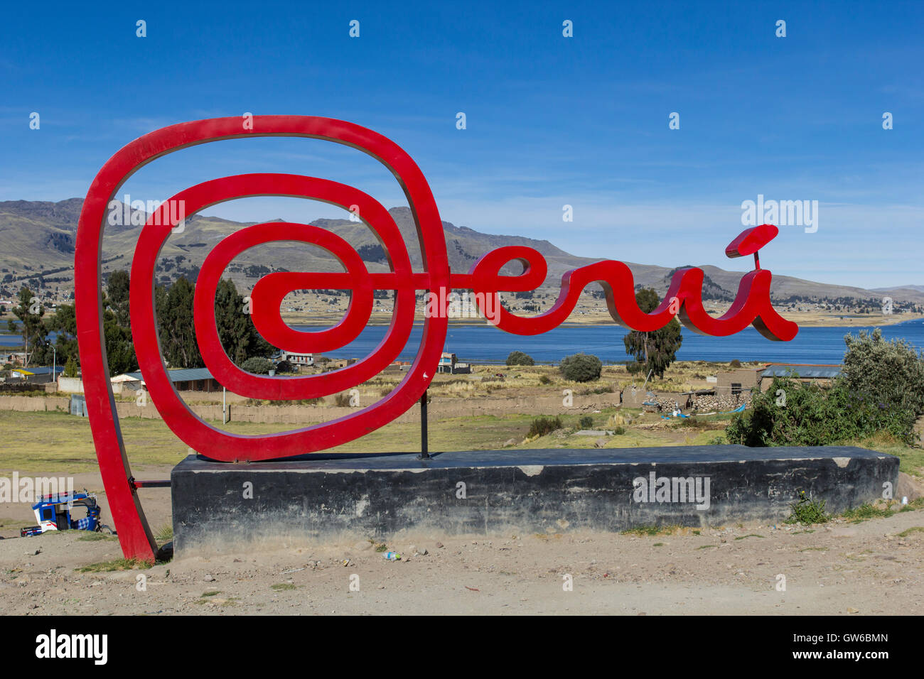 YUNGUYO, PERU - MAY 29, 2015: Red Peru sign along the road close to the ...