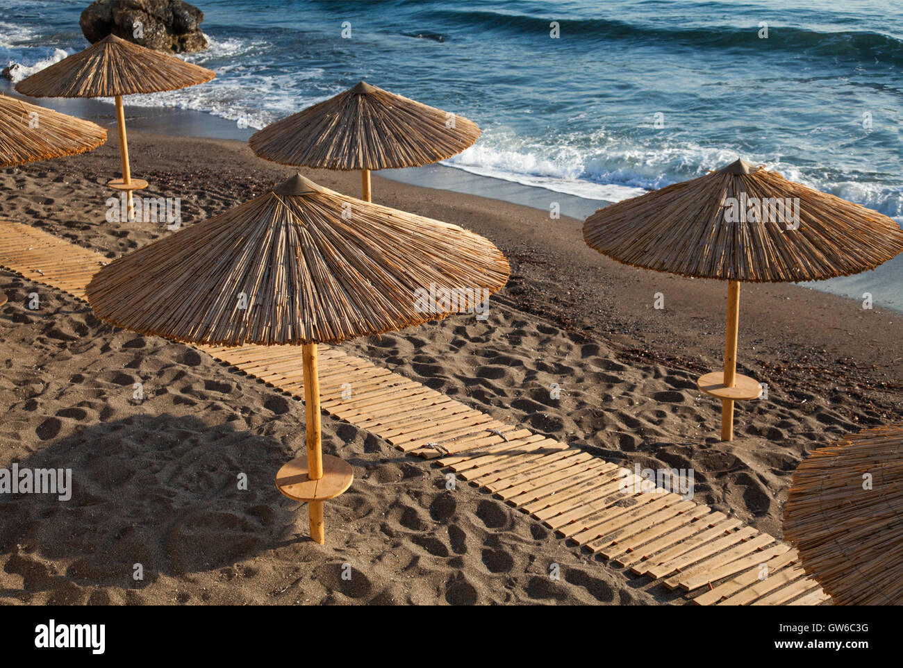 Dark sand beach on Crete, Greece Stock Photo - Alamy