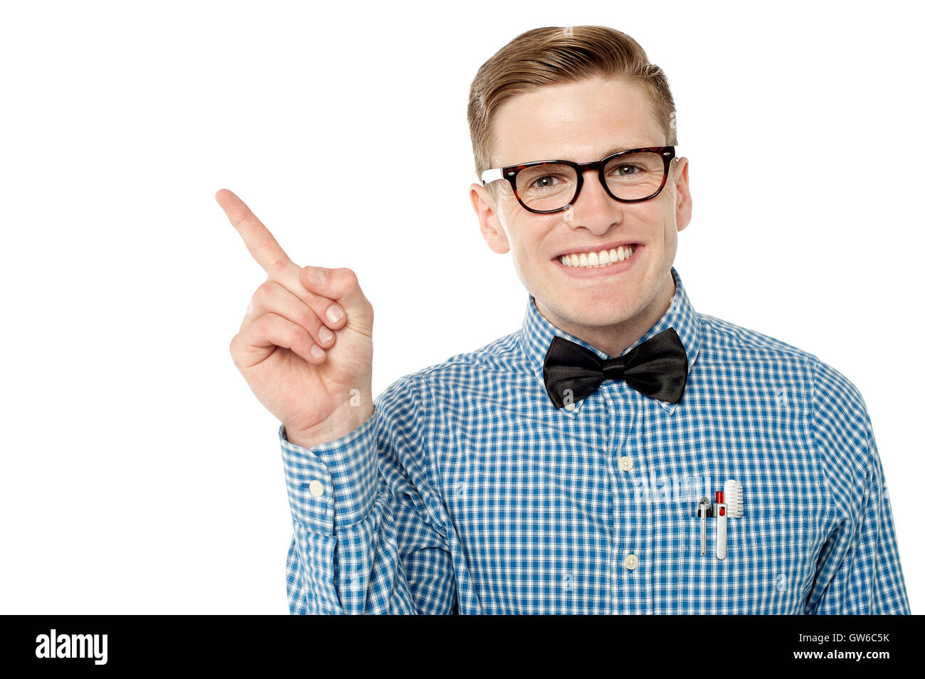 Smiling nerd pointing away Stock Photo - Alamy