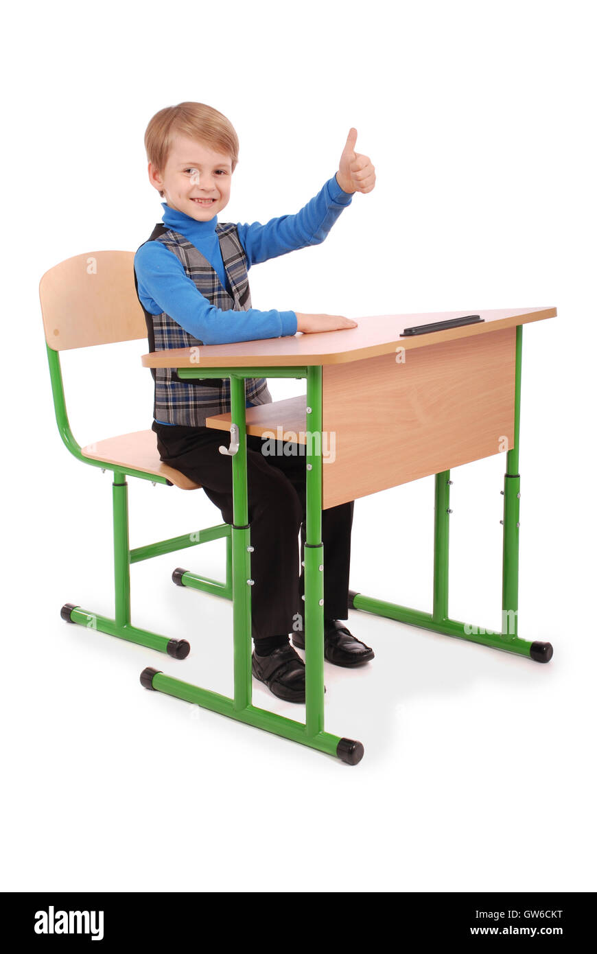 Boy Success. Boy sitting at a school desk isolated on white Stock Photo ...