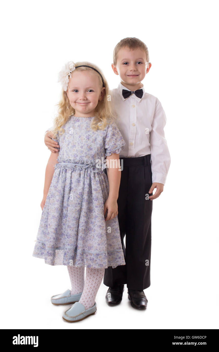 Smiling brother and sister standing together Stock Photo - Alamy