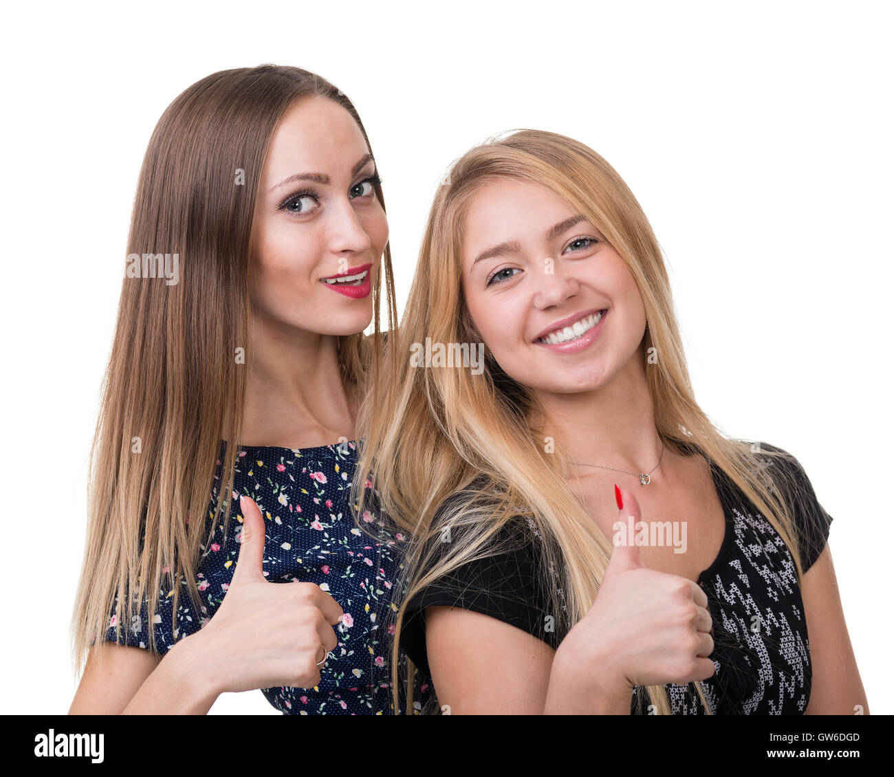 Two young women showing thumbs up, isolated over a white Stock Photo ...