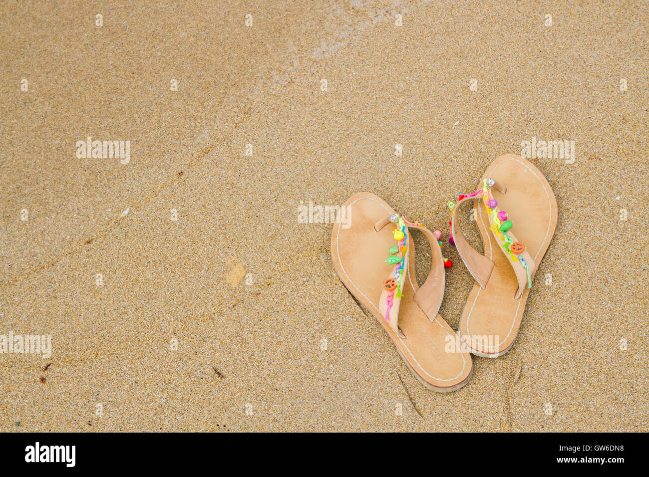 Summer flip flops on the beach Stock Photo - Alamy