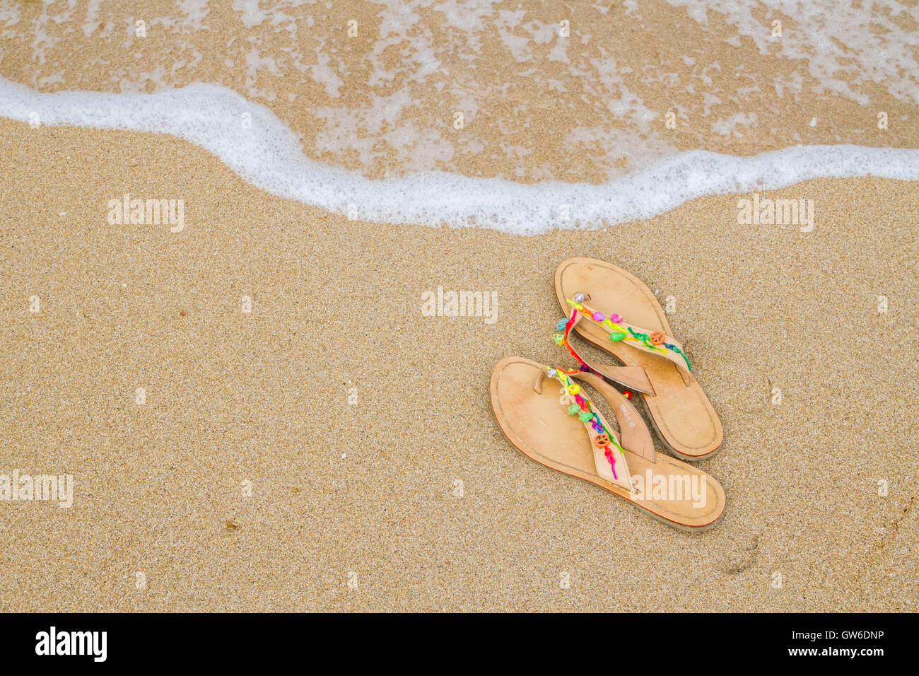 Summer flip flops on the beach Stock Photo - Alamy
