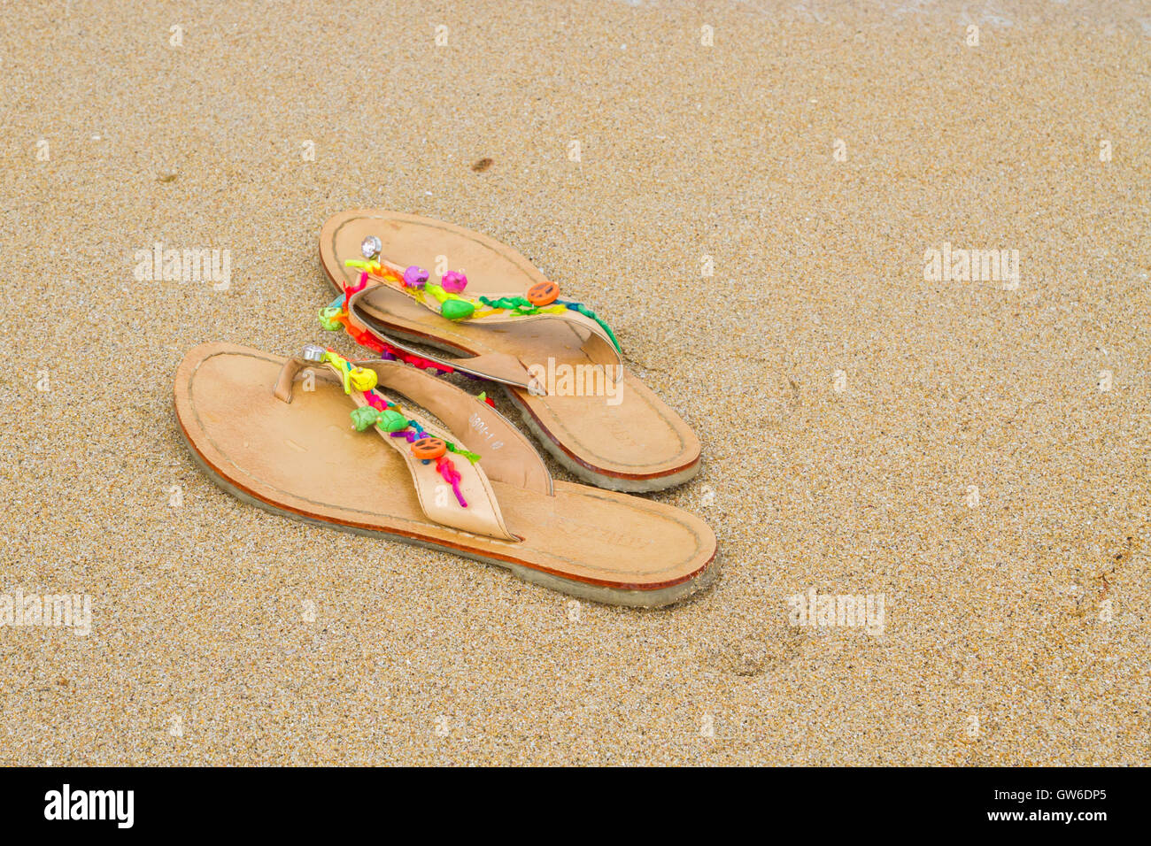 Summer flip flops on the beach Stock Photo - Alamy