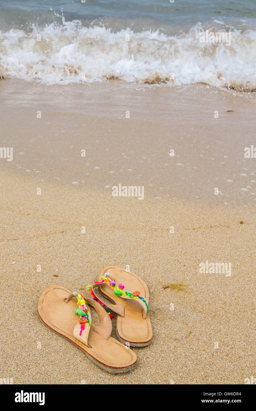 Summer flip flops on the beach Stock Photo - Alamy