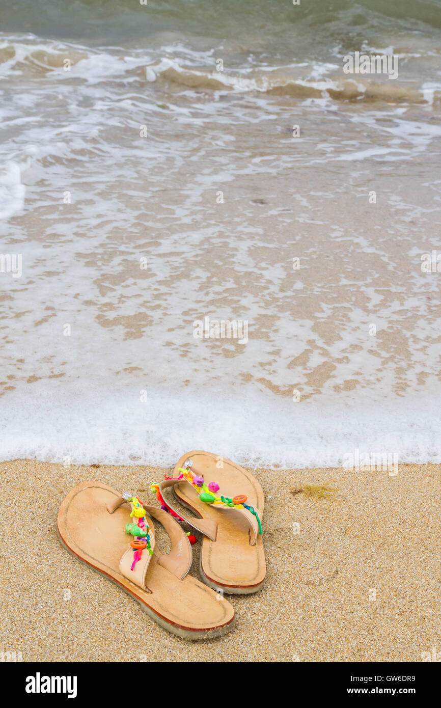 Summer flip flops on the beach Stock Photo - Alamy