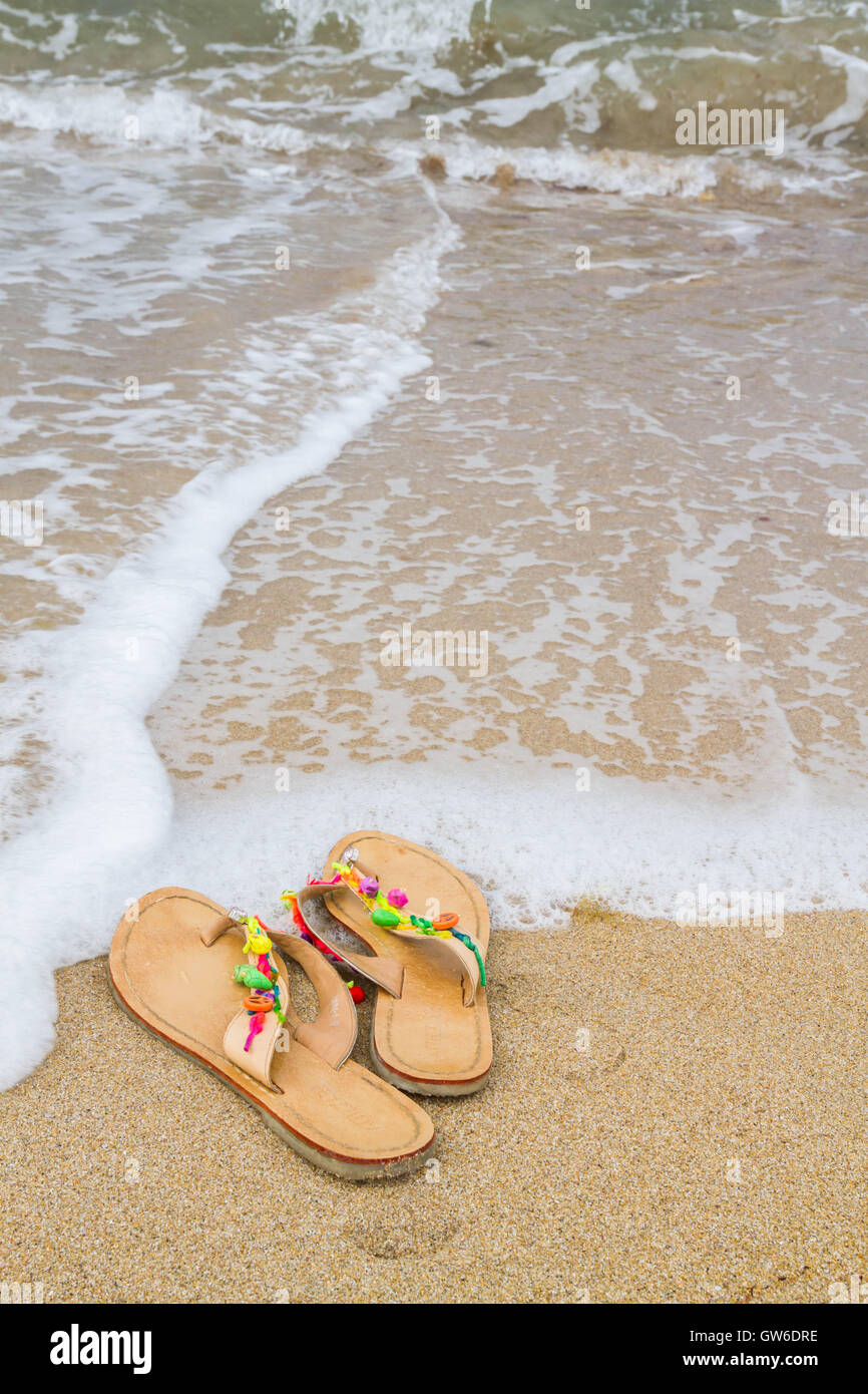 Summer flip flops on the beach Stock Photo - Alamy