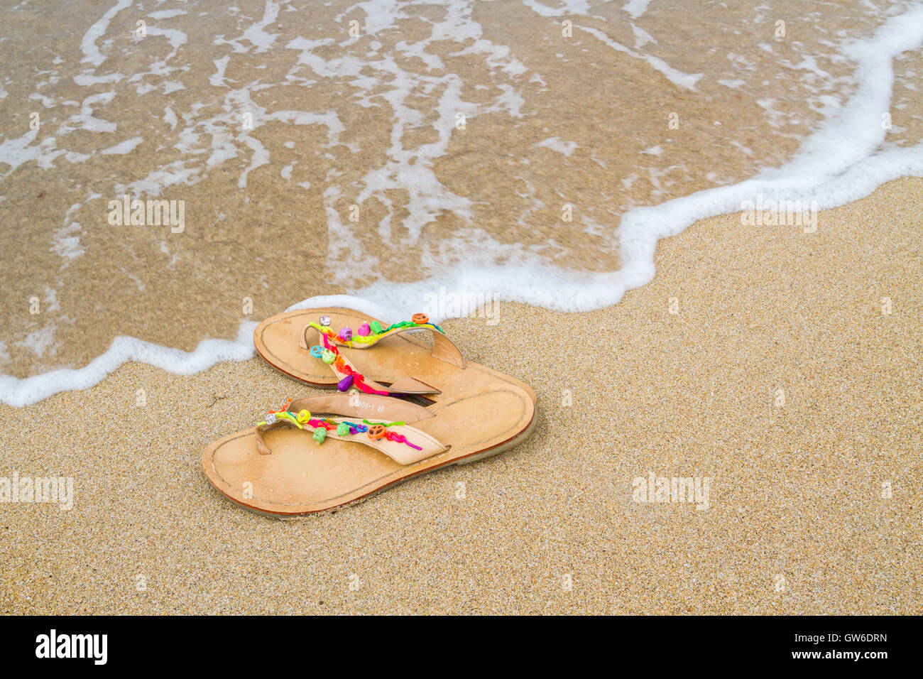 Summer flip flops on the beach Stock Photo - Alamy