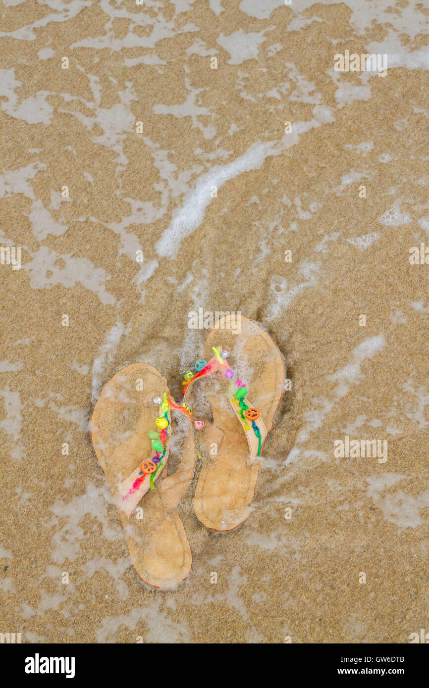 Summer flip flops on the beach Stock Photo - Alamy