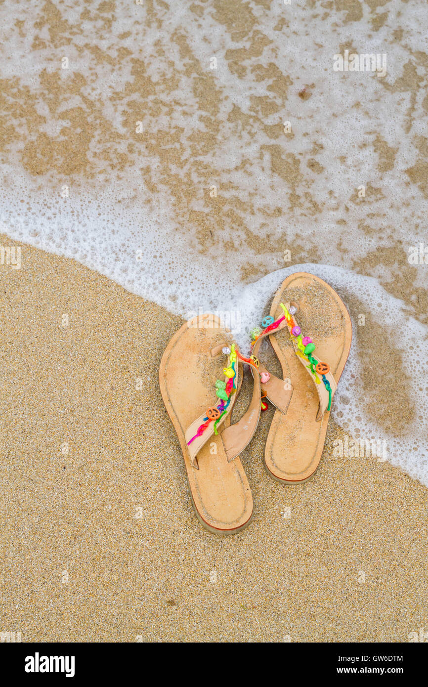Summer flip flops on the beach Stock Photo - Alamy