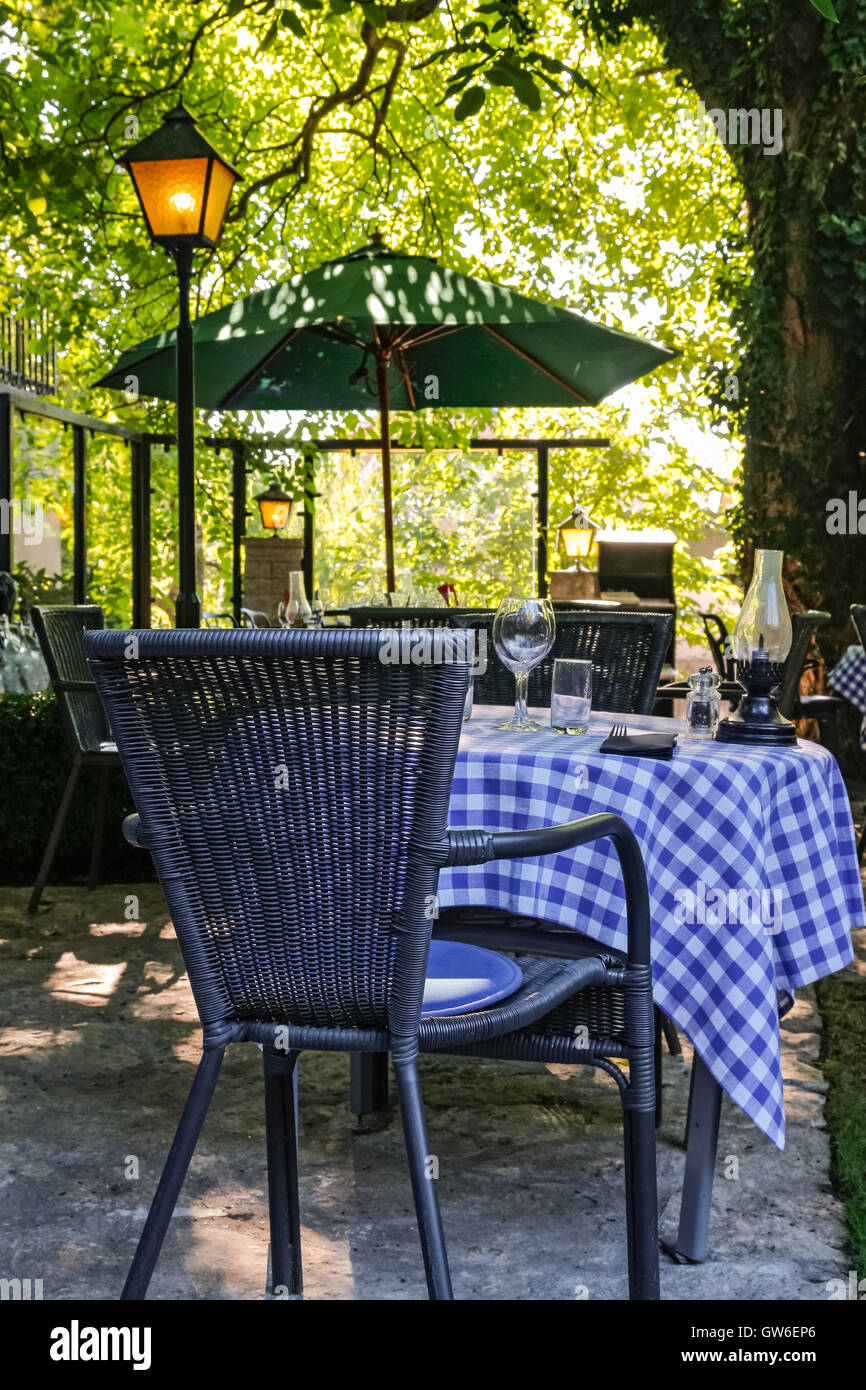 Outdoor cafe in sunlight Stock Photo - Alamy