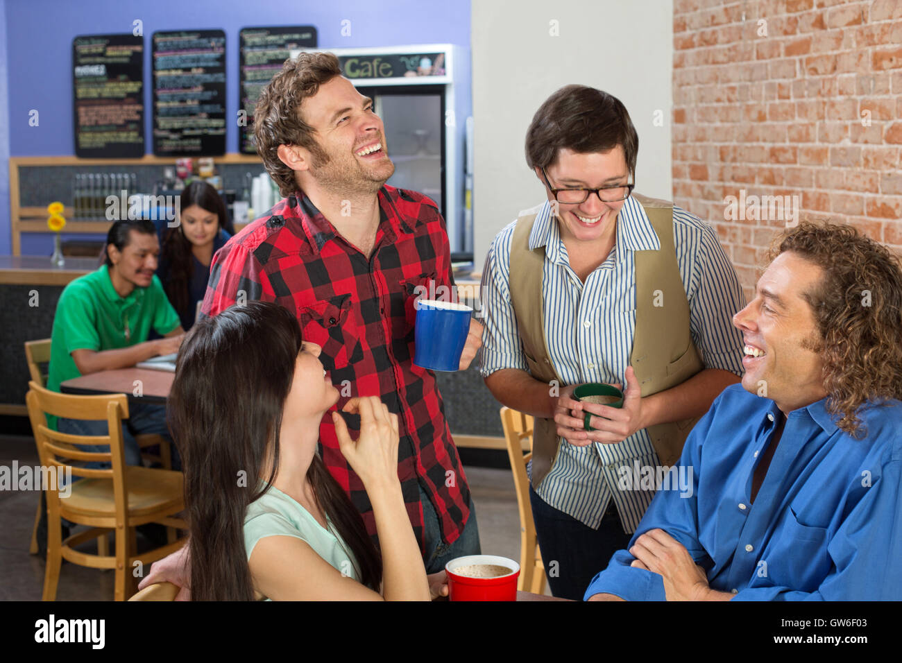 Four People Joking Stock Photo - Alamy
