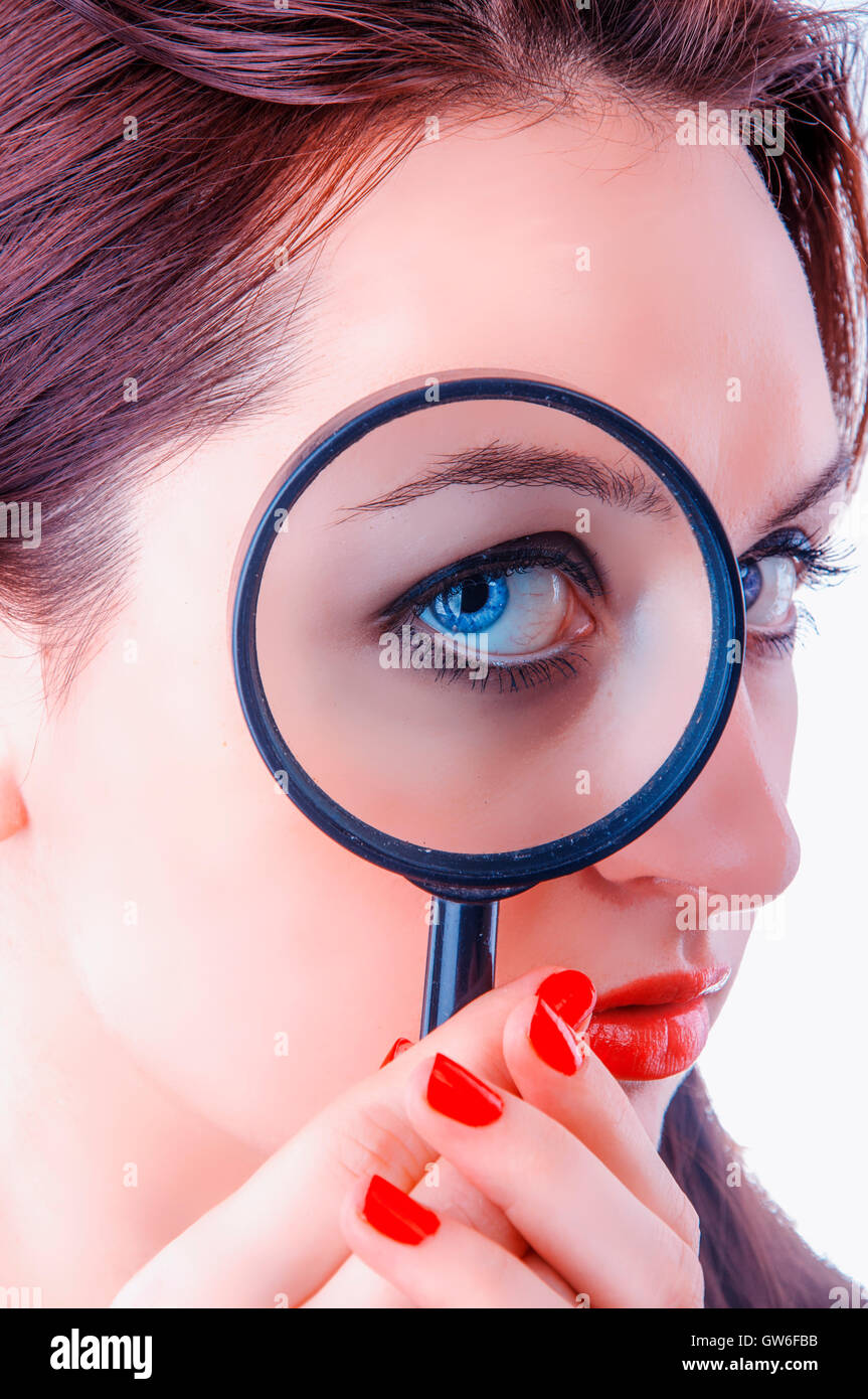 Women with magnifying glass Stock Photo - Alamy