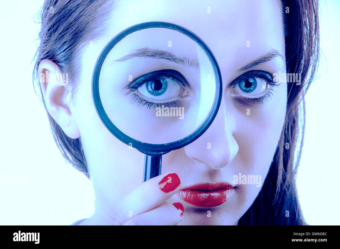 Women with magnifying glass Stock Photo - Alamy