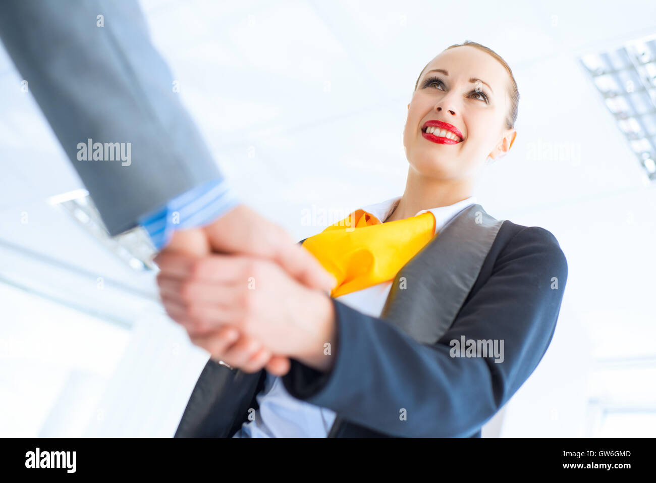 business woman shaking hands with a client Stock Photo - Alamy