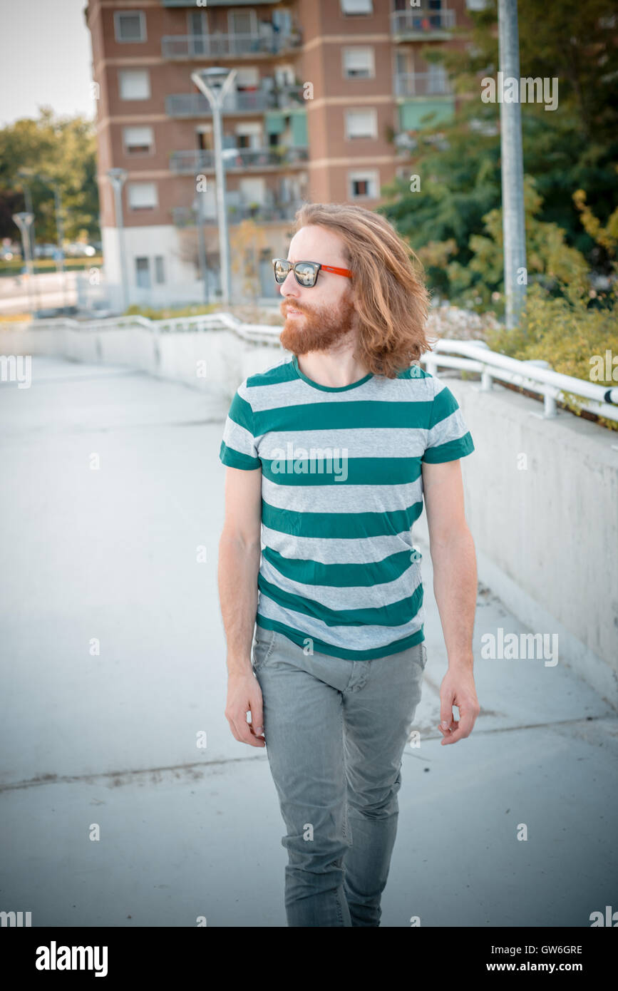 stylish hipster model with long red hair and beard lifestyle Stock ...