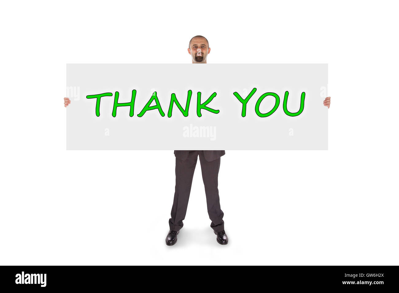 Smiling businessman holding a really big card Stock Photo - Alamy