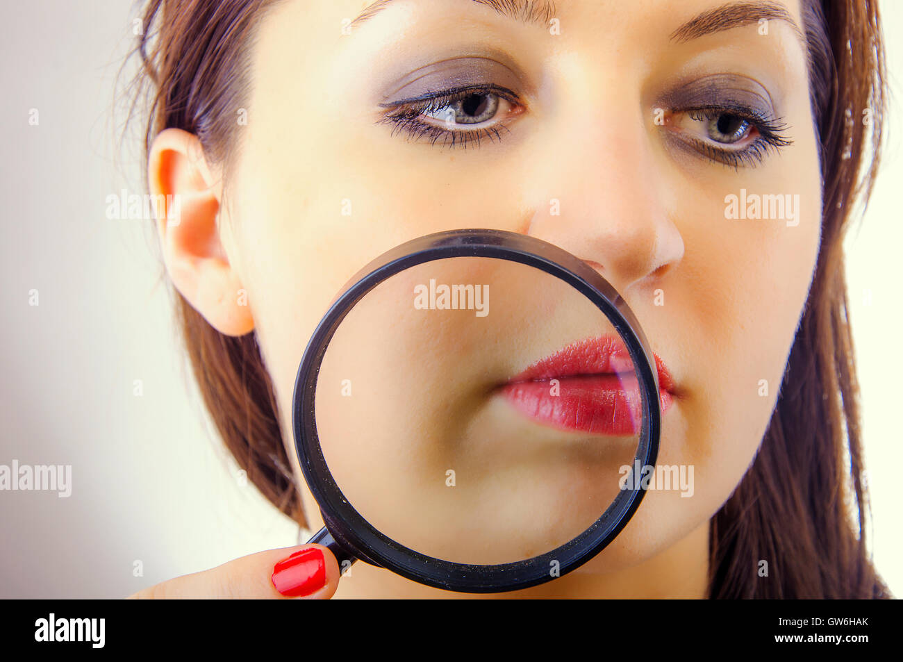 Women with magnifying glass Stock Photo - Alamy