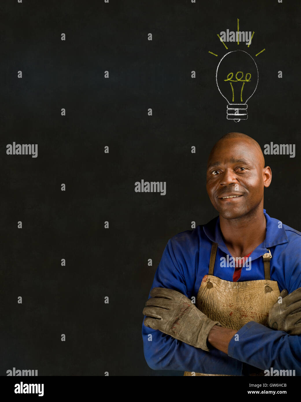 African black man industrial worker with chalk light bulb blackboard ...