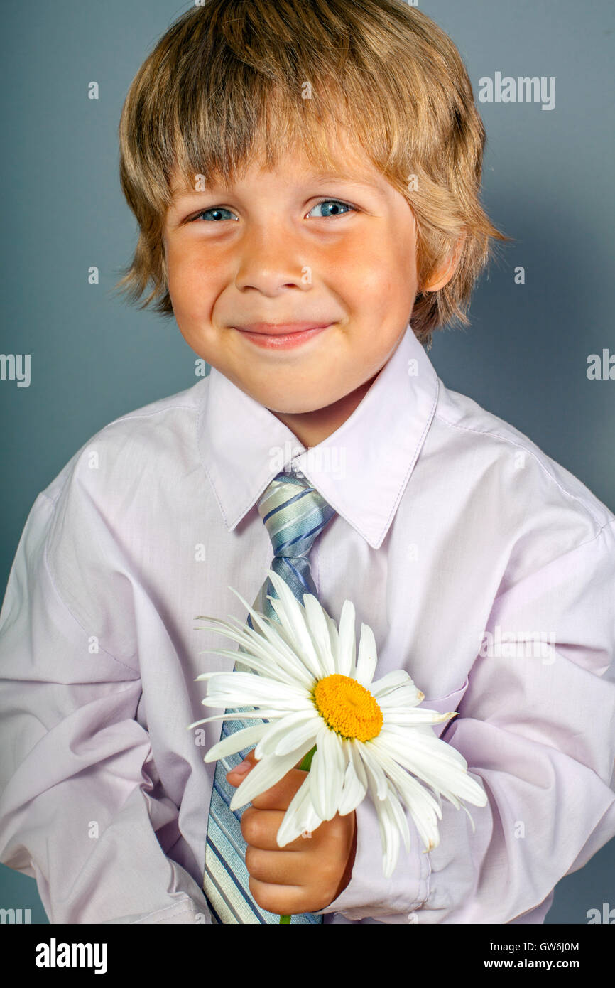 handsome boy with flowers in hands Stock Photo - Alamy