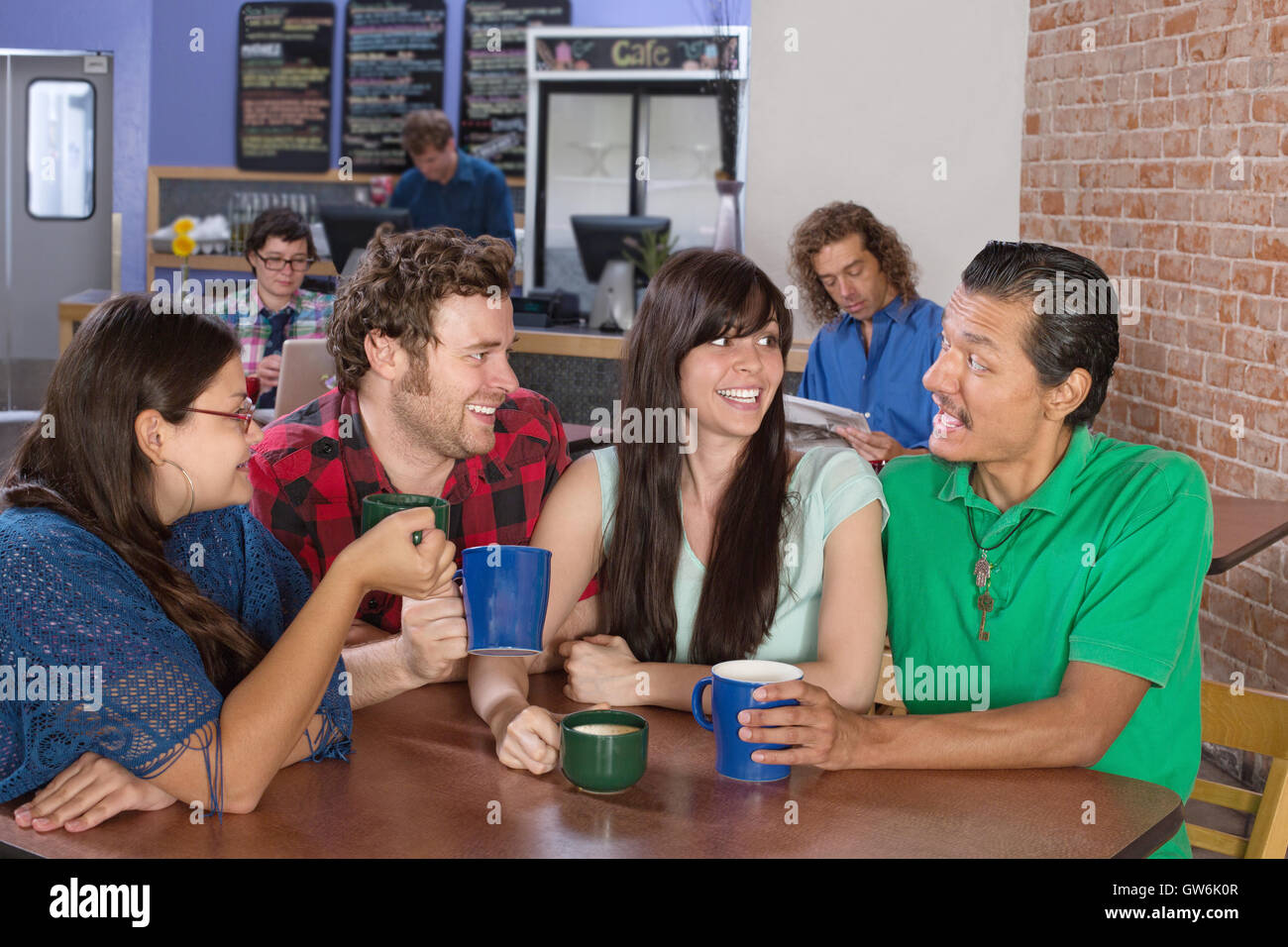 Handsome group young people socializing hi-res stock photography and images - Alamy