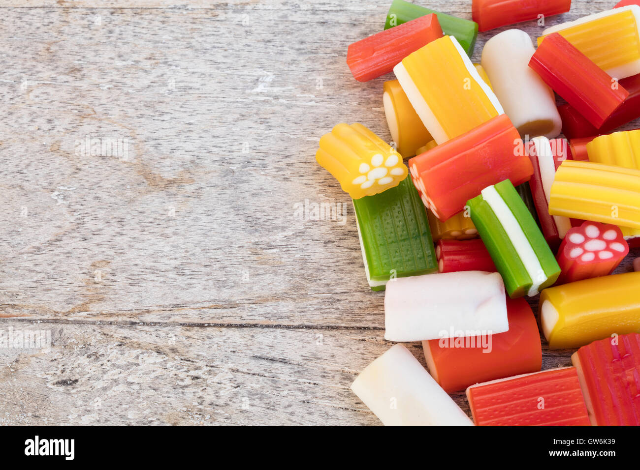 Colorful gummy jellies and sweets on a wooden table Stock Photo - Alamy