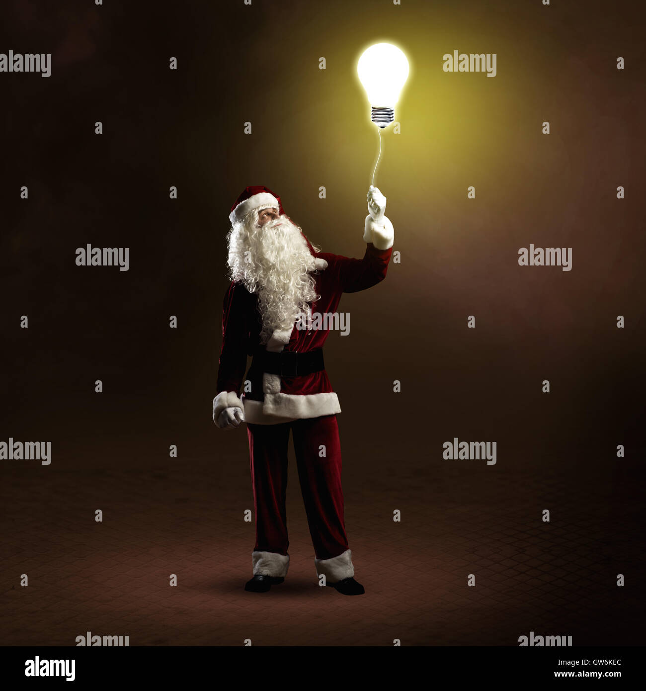 Santa claus holding shining lamp hi-res stock photography and images ...