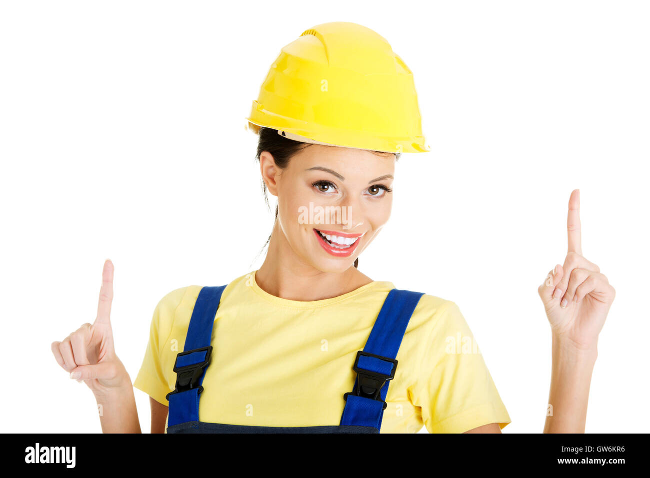 Female construction worker pointing on copy space Stock Photo - Alamy