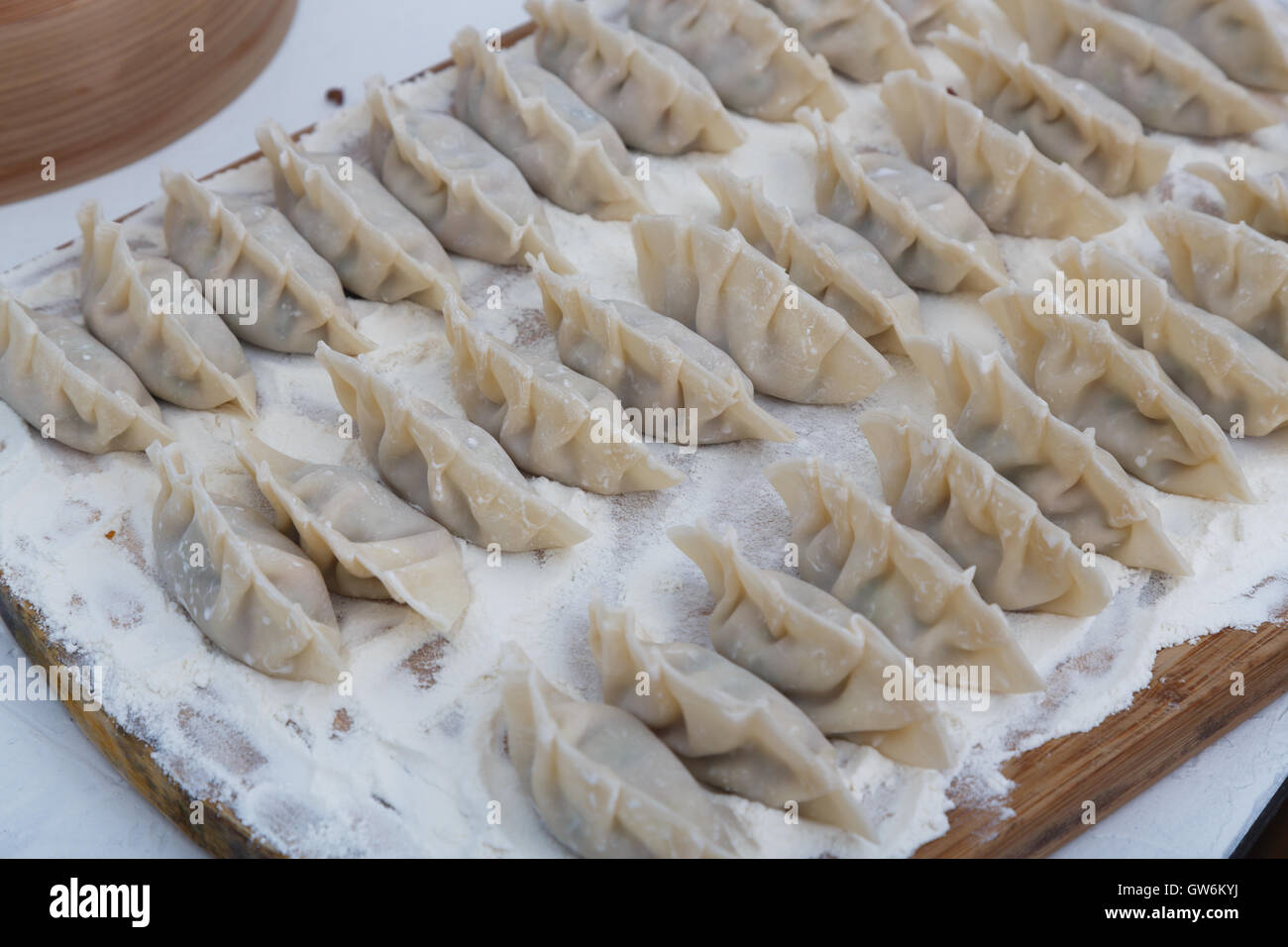 raw dumplings on the wooden desk, top view Stock Photo - Alamy