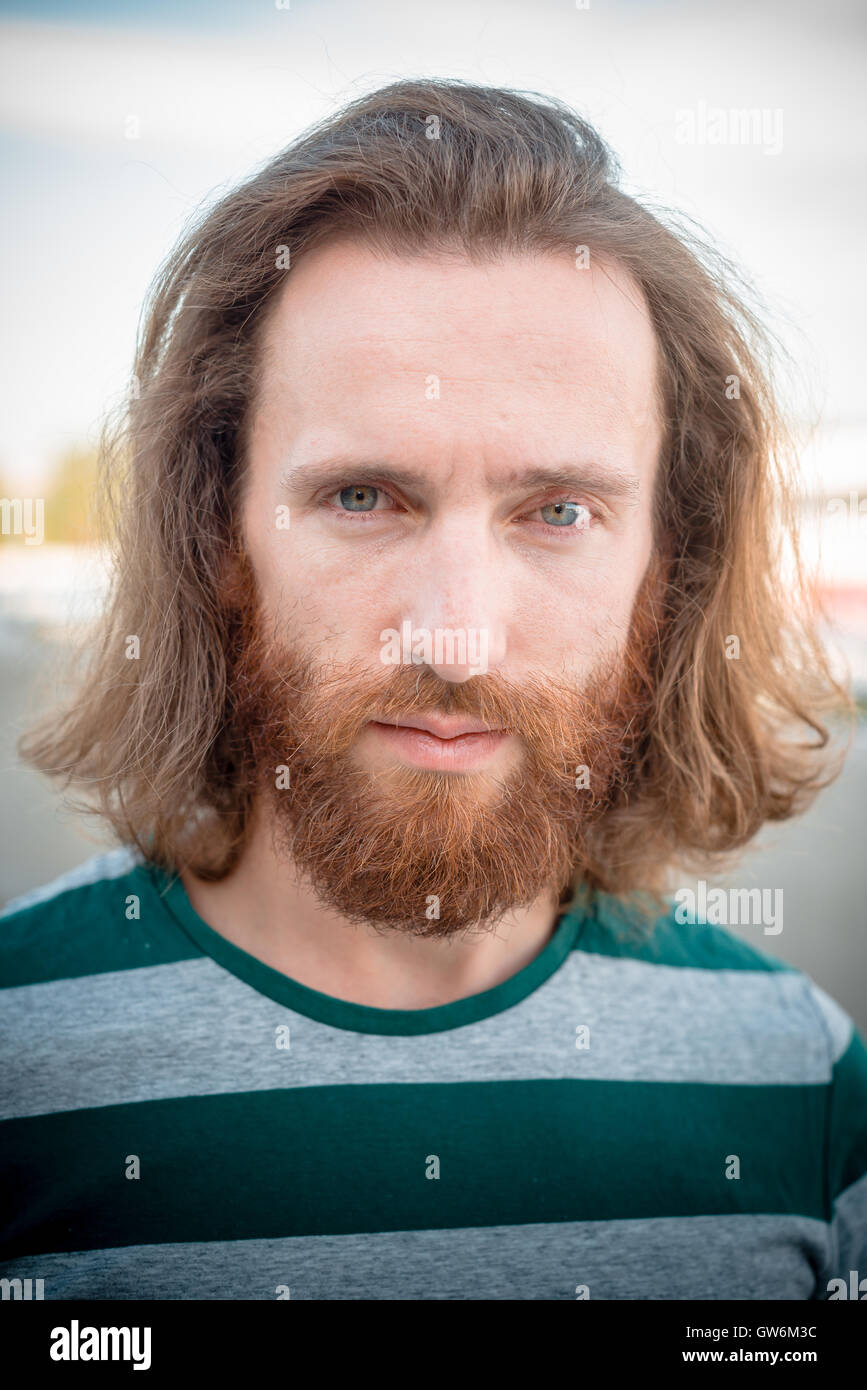 stylish hipster model with long red hair and beard lifestyle Stock ...