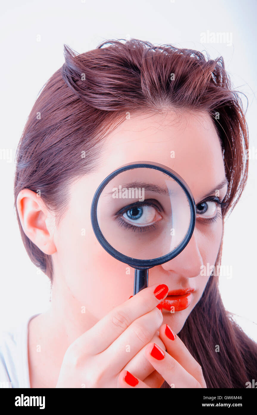 Women with magnifying glass Stock Photo - Alamy