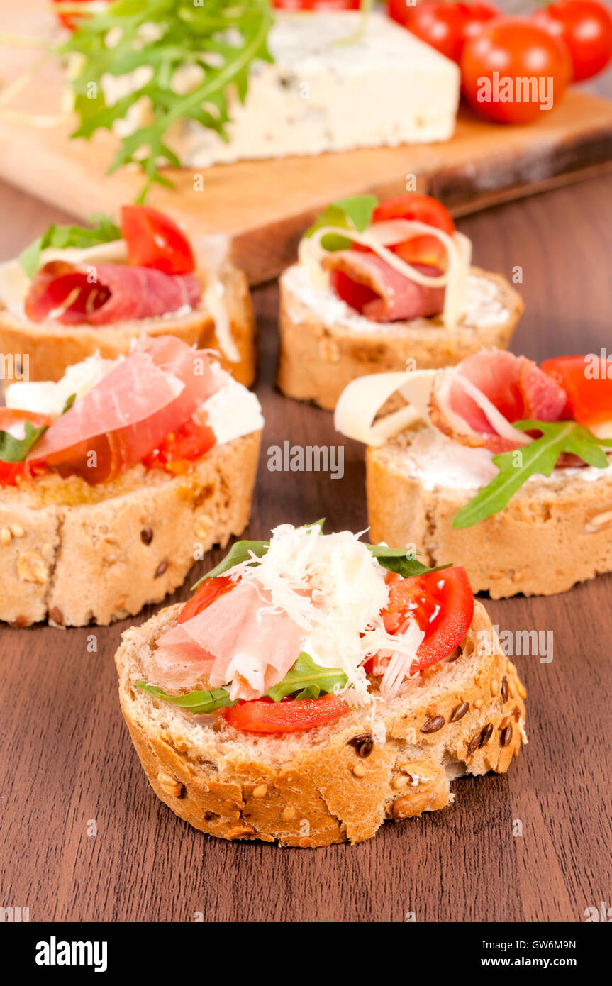Bruschetta wooden board blue italian starter hi-res stock photography ...