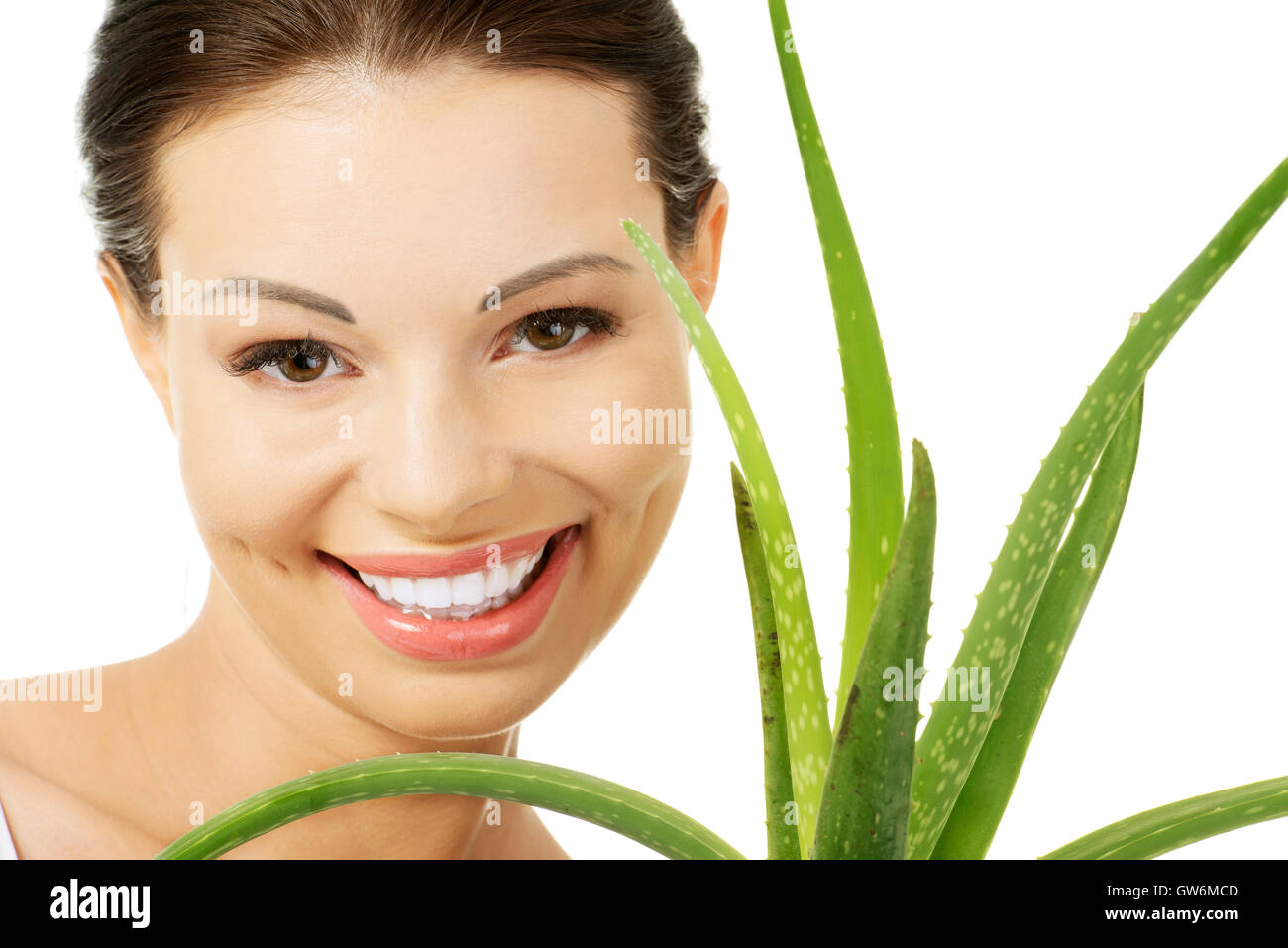 Young beautiful woman's face and aloe vera Stock Photo - Alamy