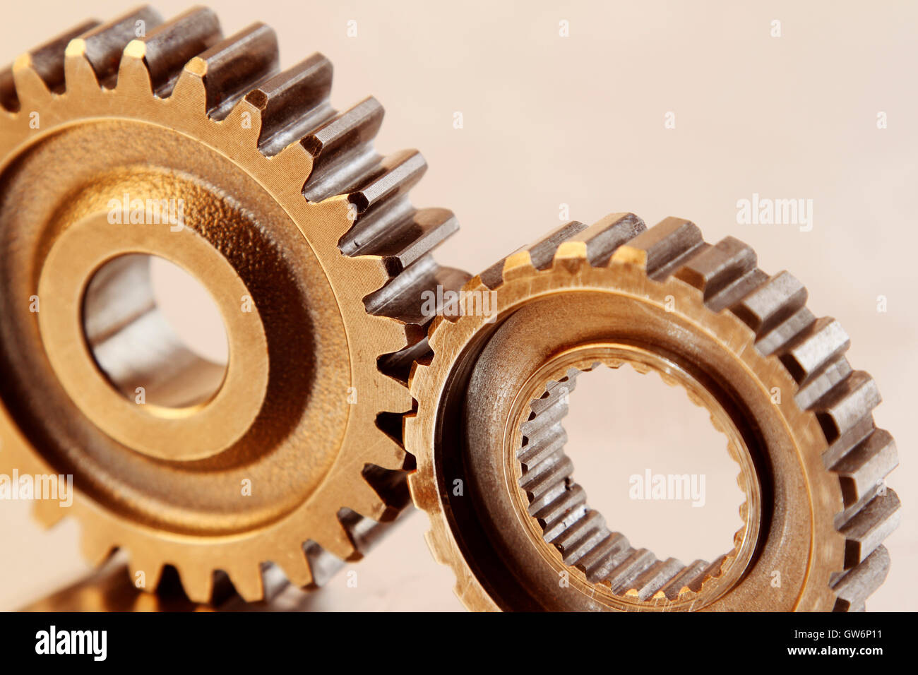 Closeup of two metal cog gears Stock Photo - Alamy