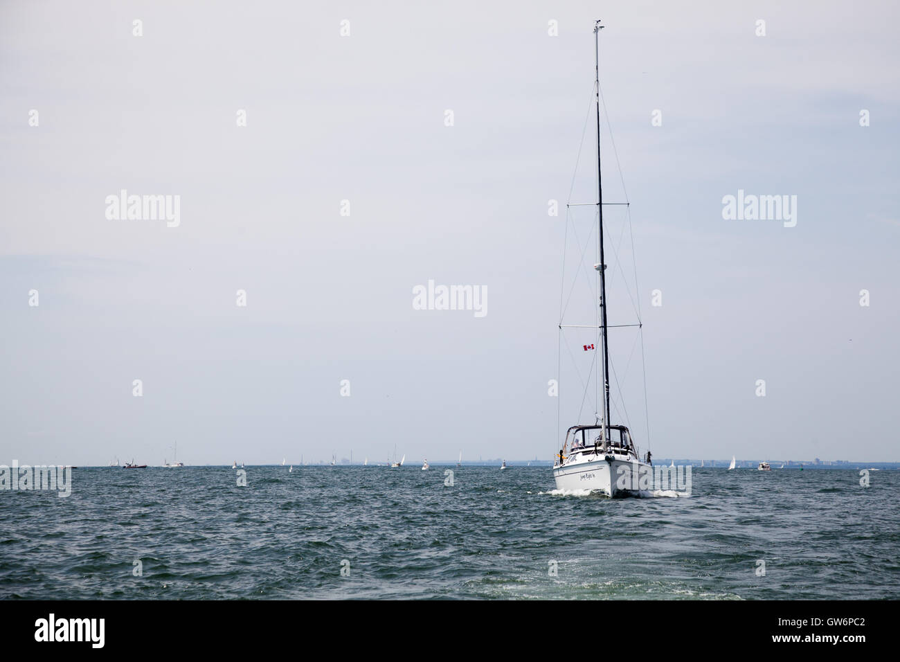 Sailboat without its sails up. Powered by motor Stock Photo - Alamy
