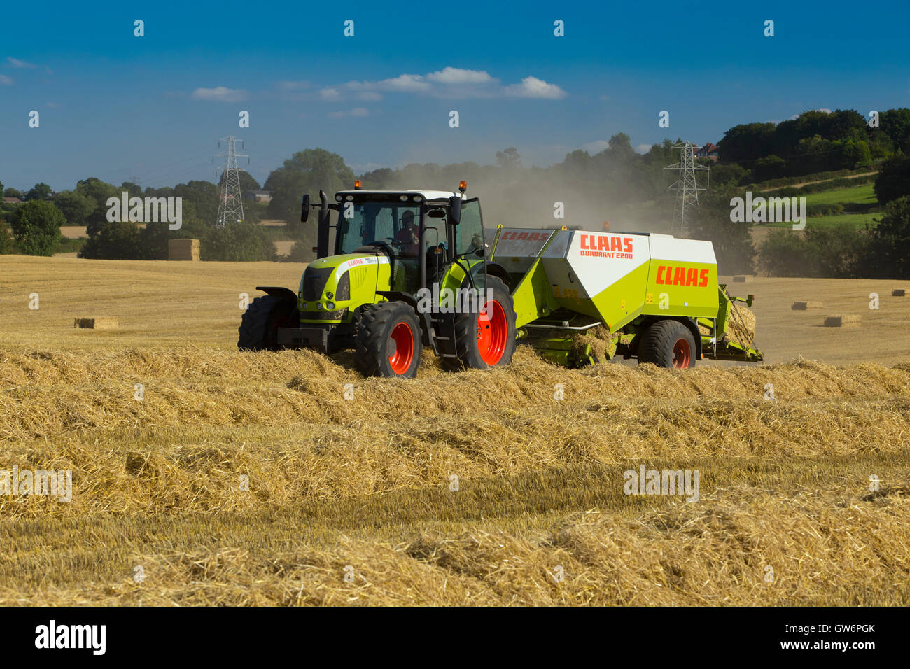 Claas Ares 697 ATZ baling Straw UK Stock Photo - Alamy