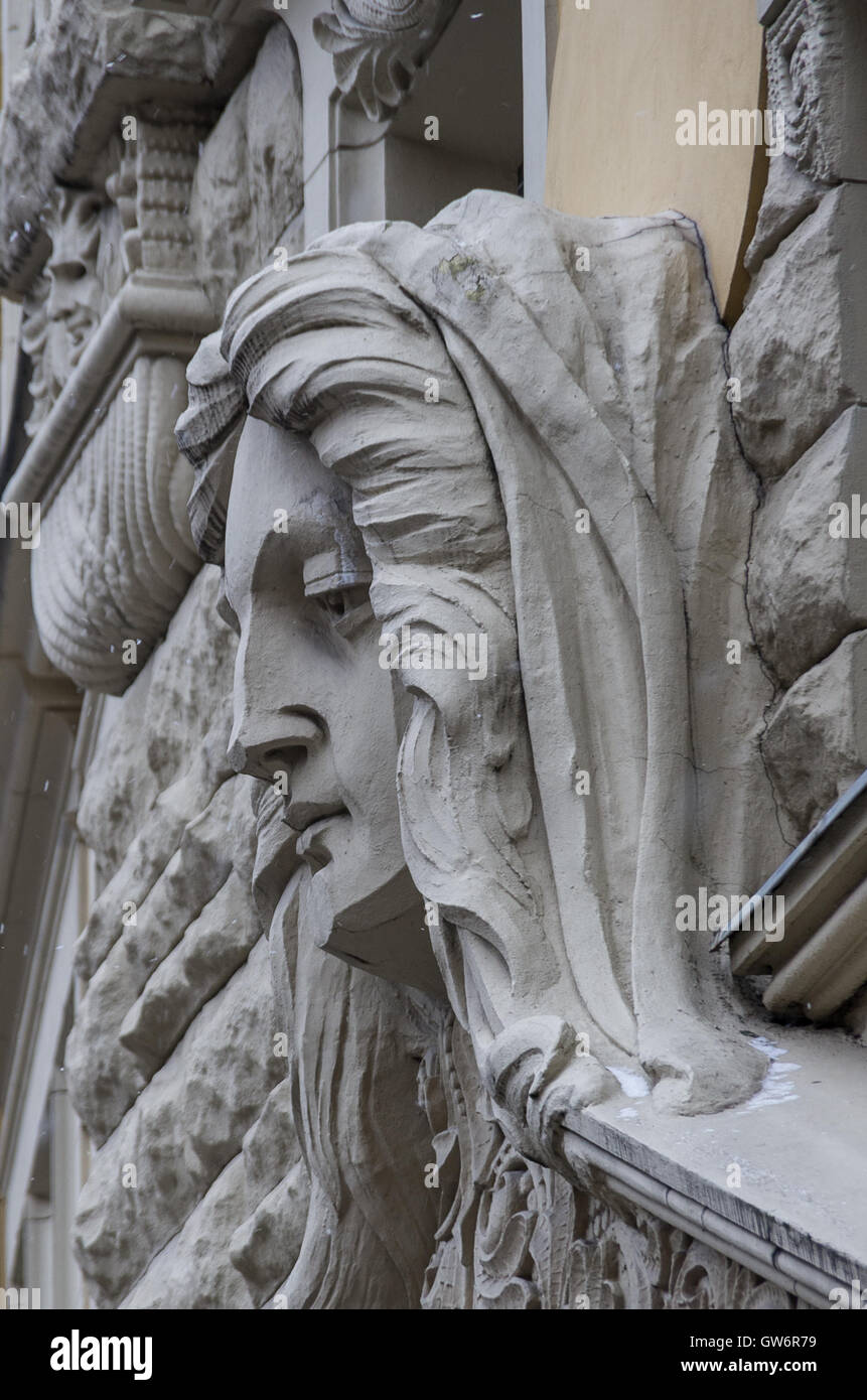 Woman's face sculpture. Art Nouveau house facade decoration in Riga old ...