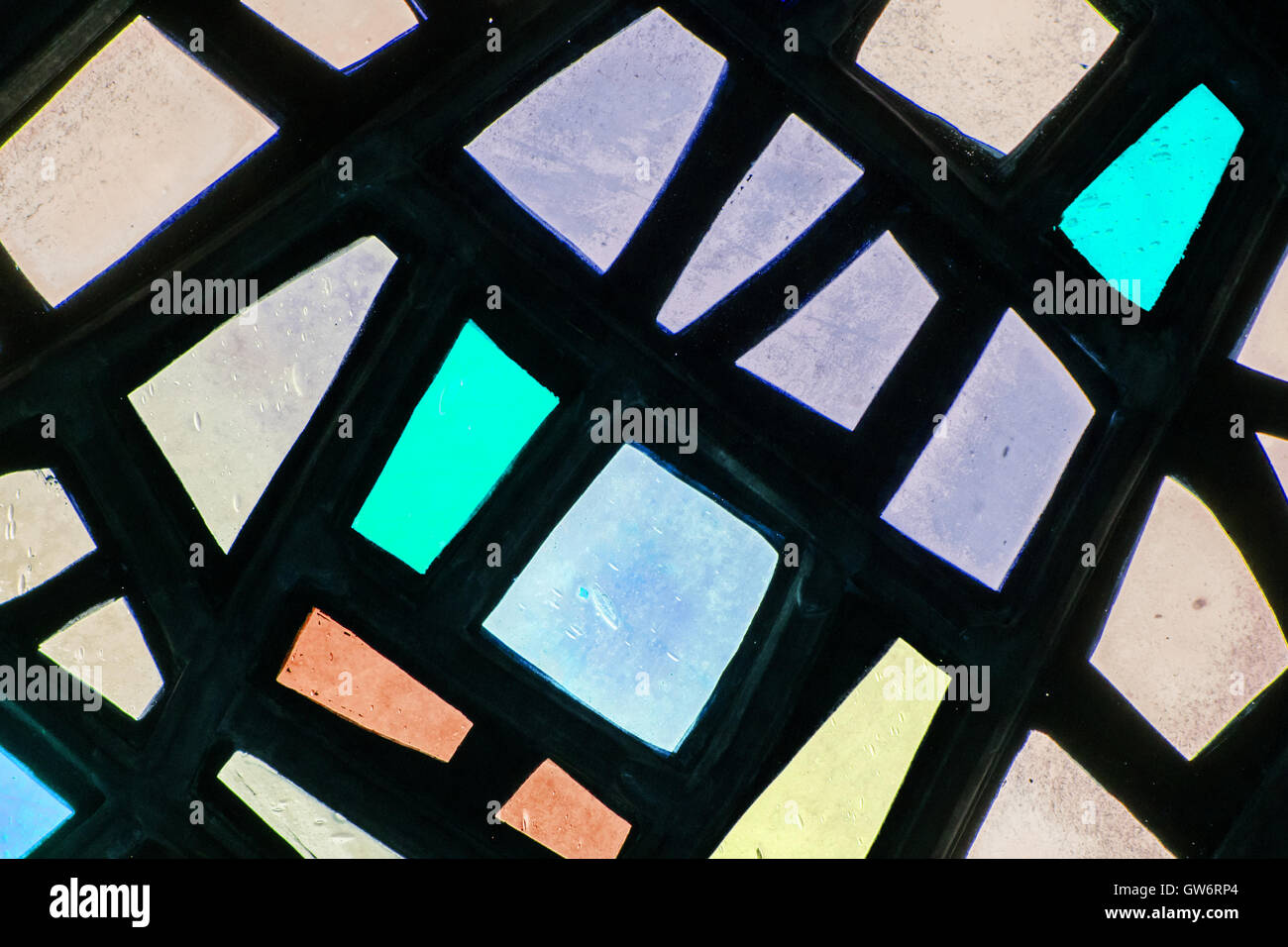 Image of a multicolored stained glass window with irregular block ...