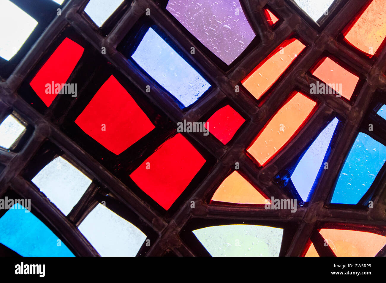 Image of a multicolored stained glass window with irregular block ...