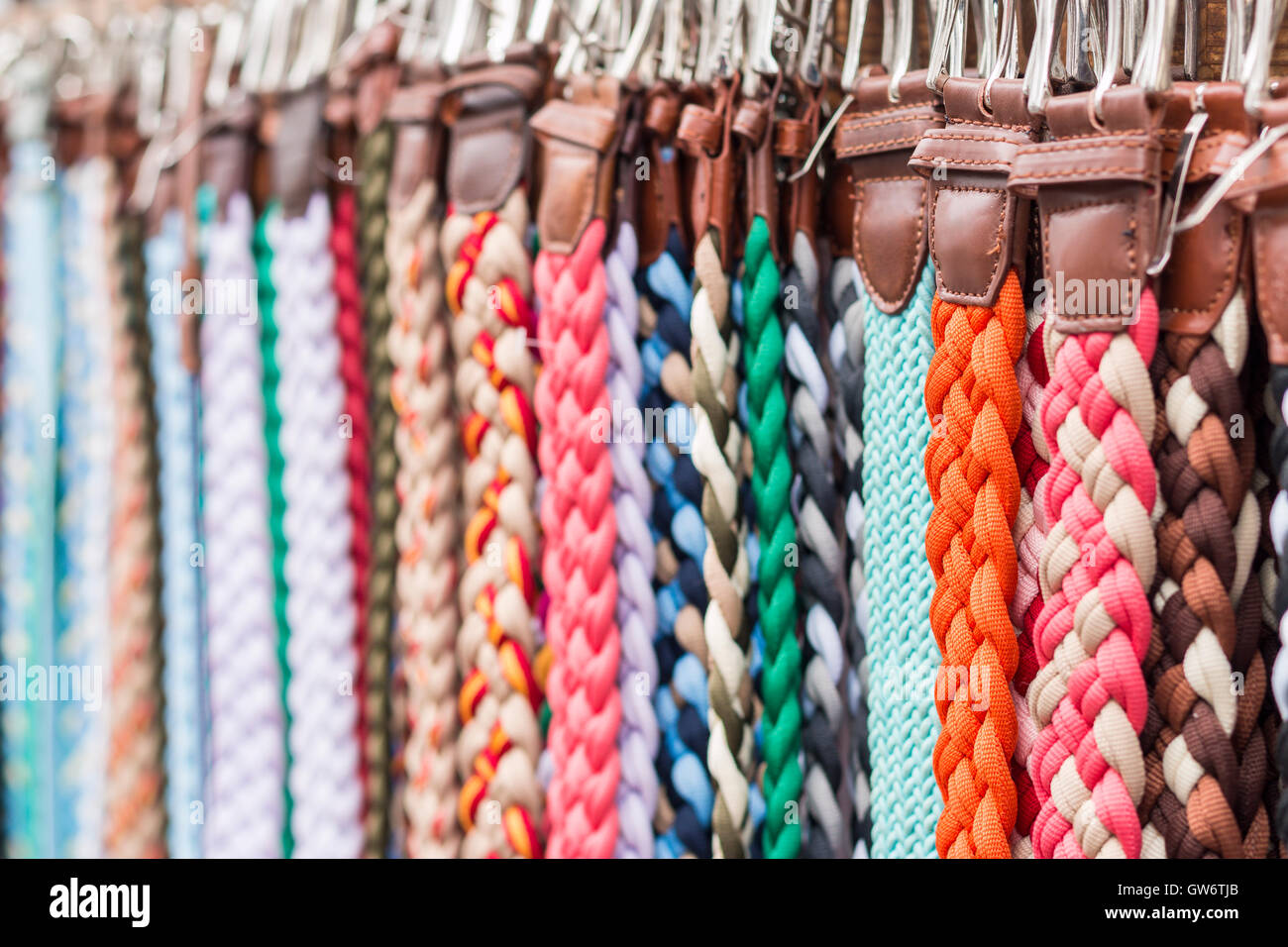 Background colorful variety of straps hanging from the wall Stock Photo ...
