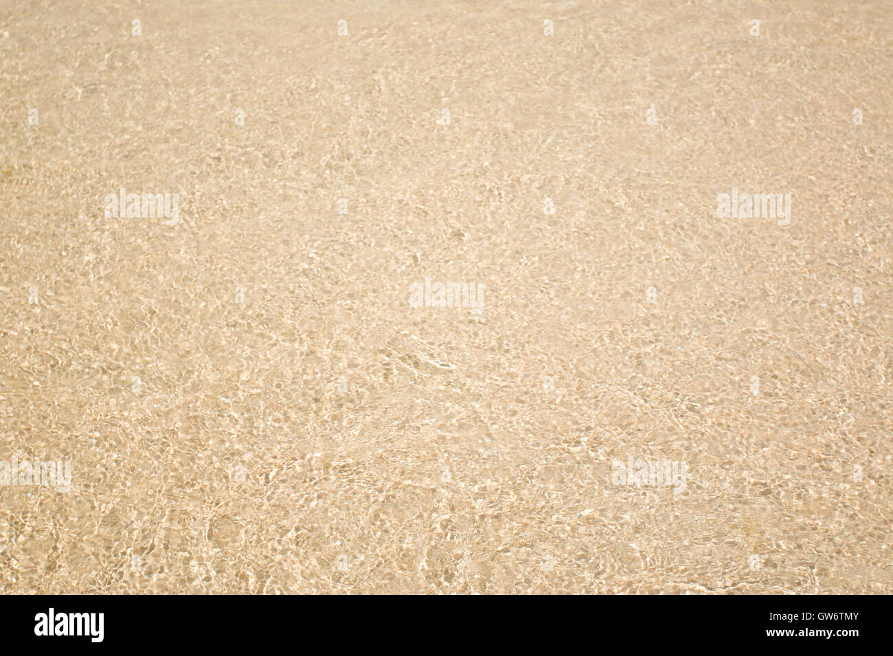 Golden brown sand of beach texture background Stock Photo - Alamy