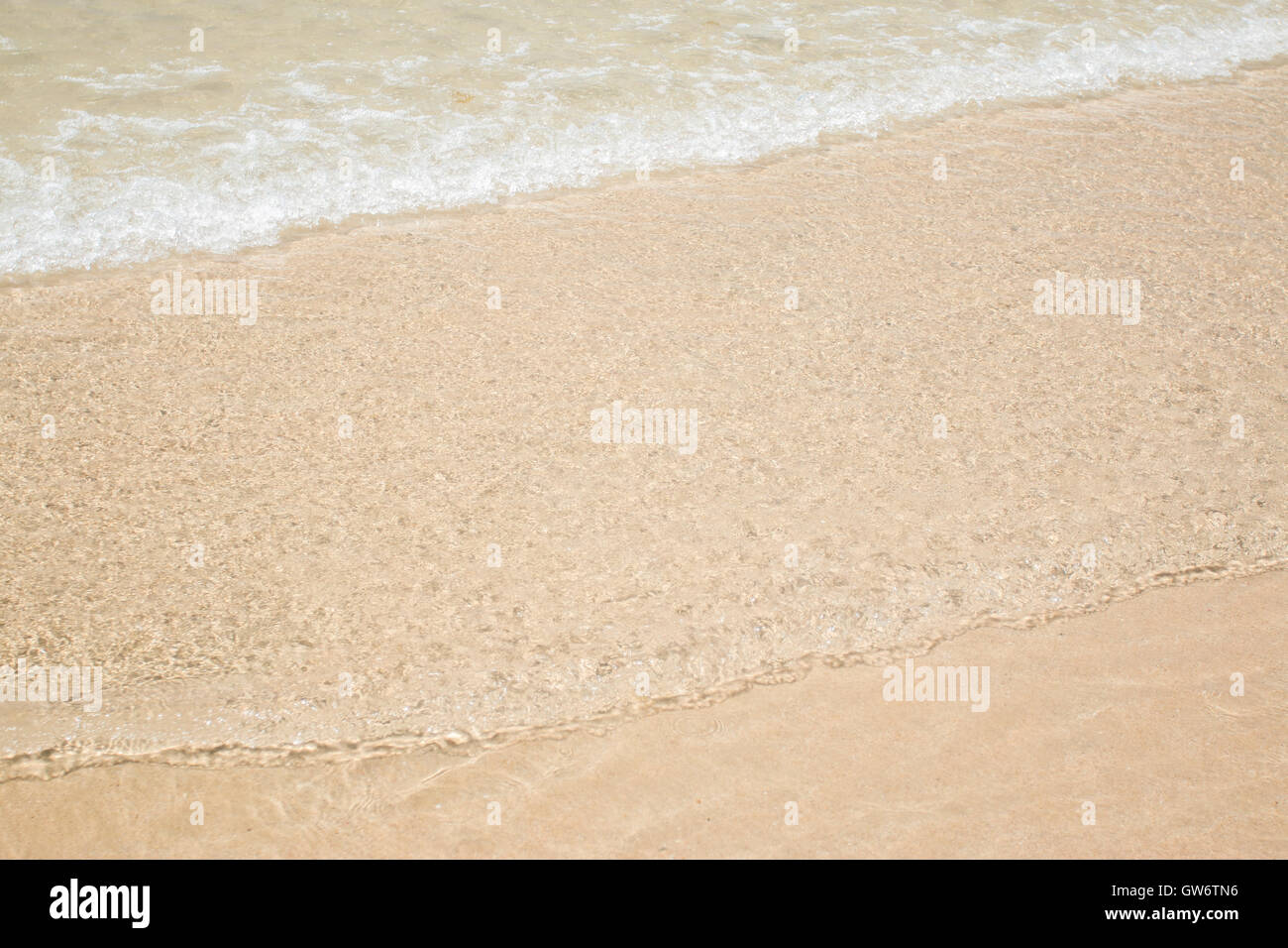 Golden brown sand of beach texture background Stock Photo - Alamy