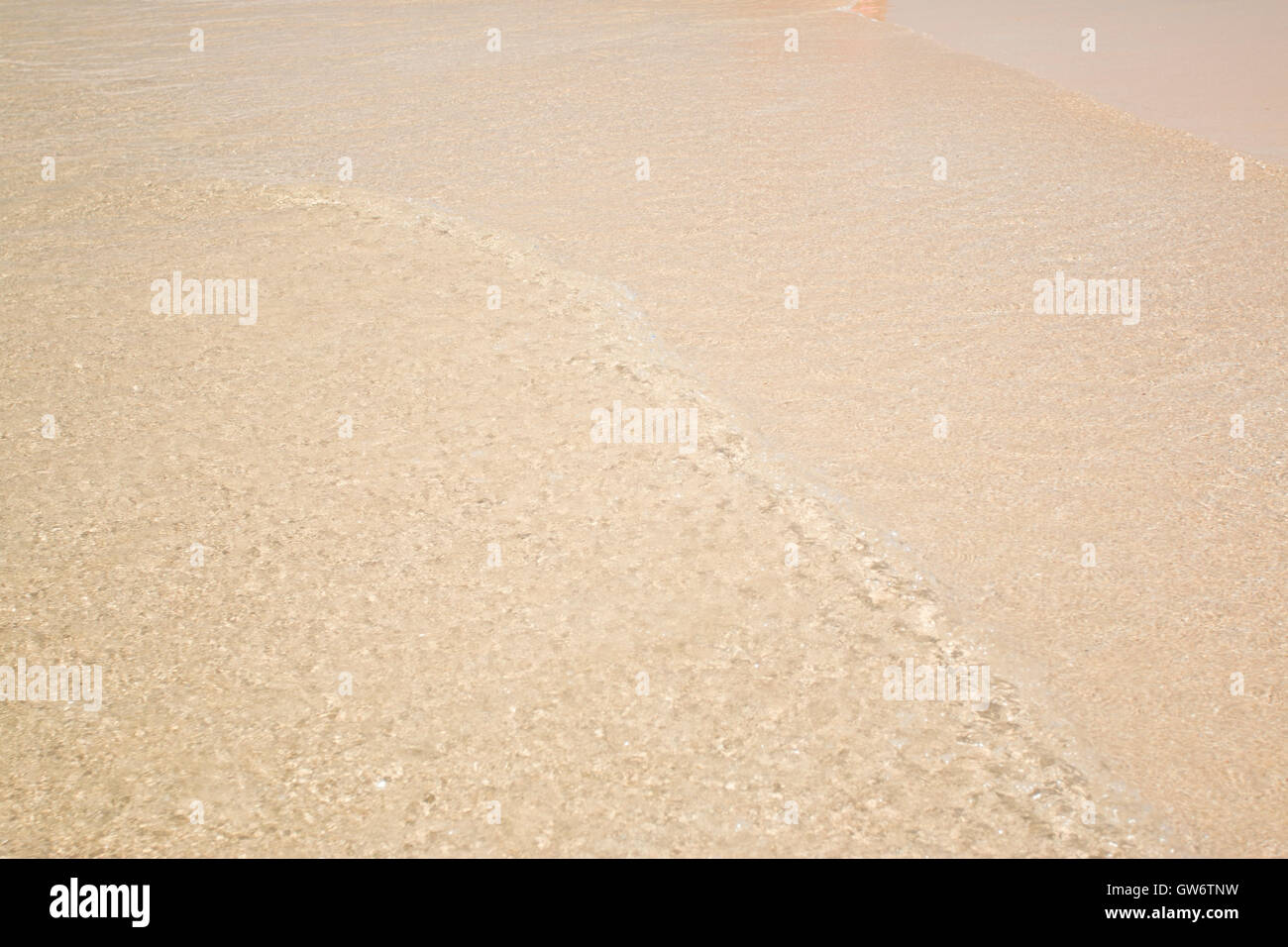 Golden brown sand of beach texture background Stock Photo - Alamy