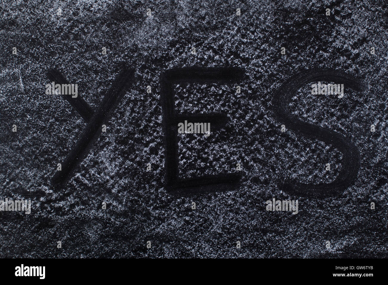 Black chalkboard with YES written on the dust Stock Photo - Alamy