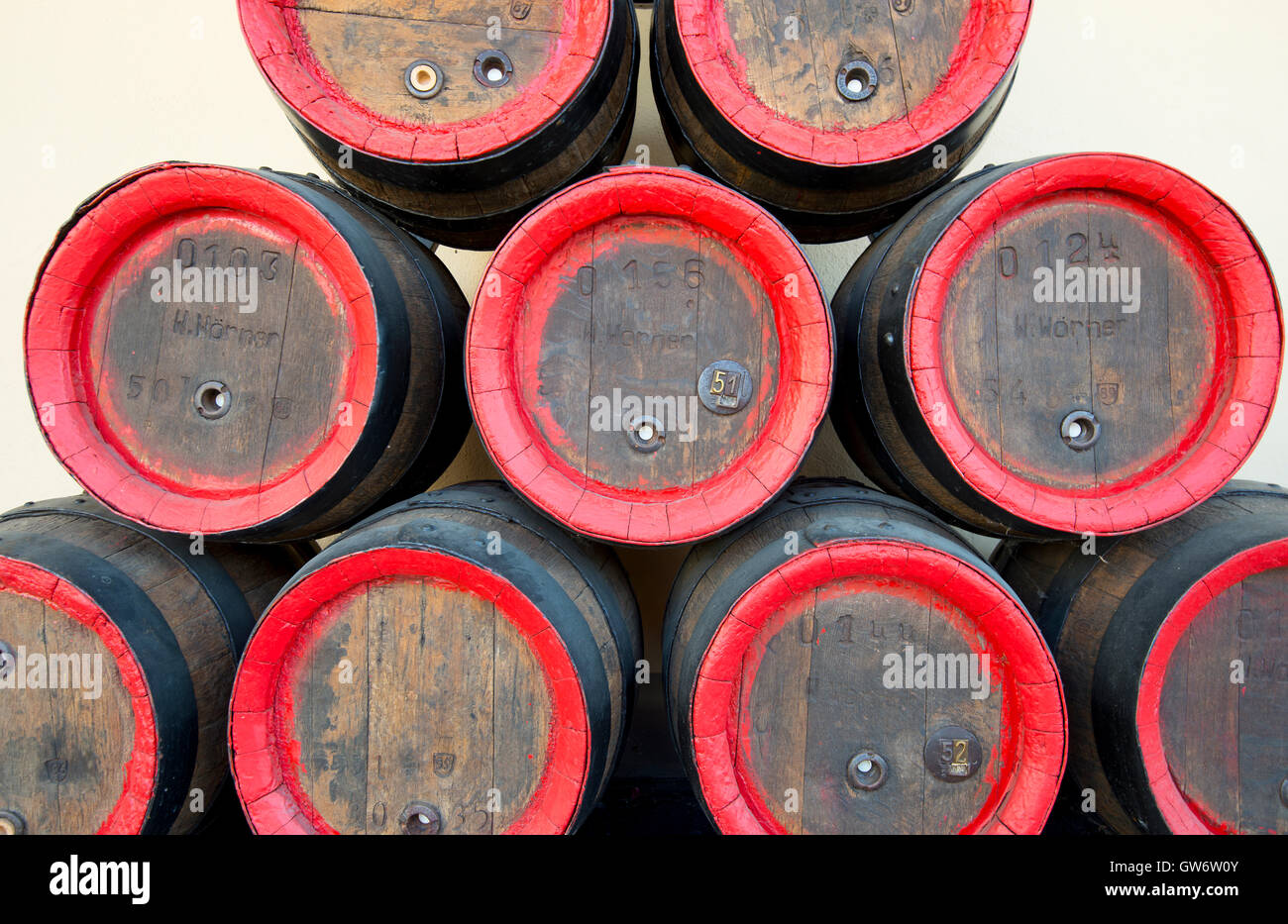 A pile of Beer kegs against the wall of a beer kegs Stock Photo - Alamy
