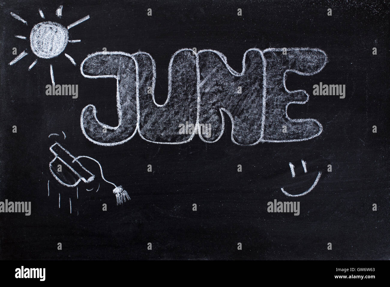 Handwritten June with sun of summer, smile and graduation cap on black ...