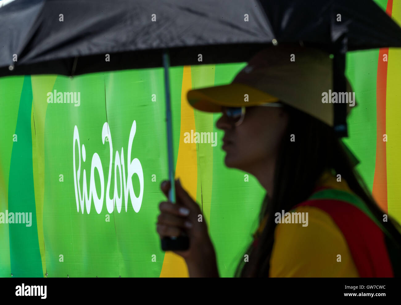 Rio De Janeiro, Brazil. 12th Sep, 2016. A volunteer protects herself ...