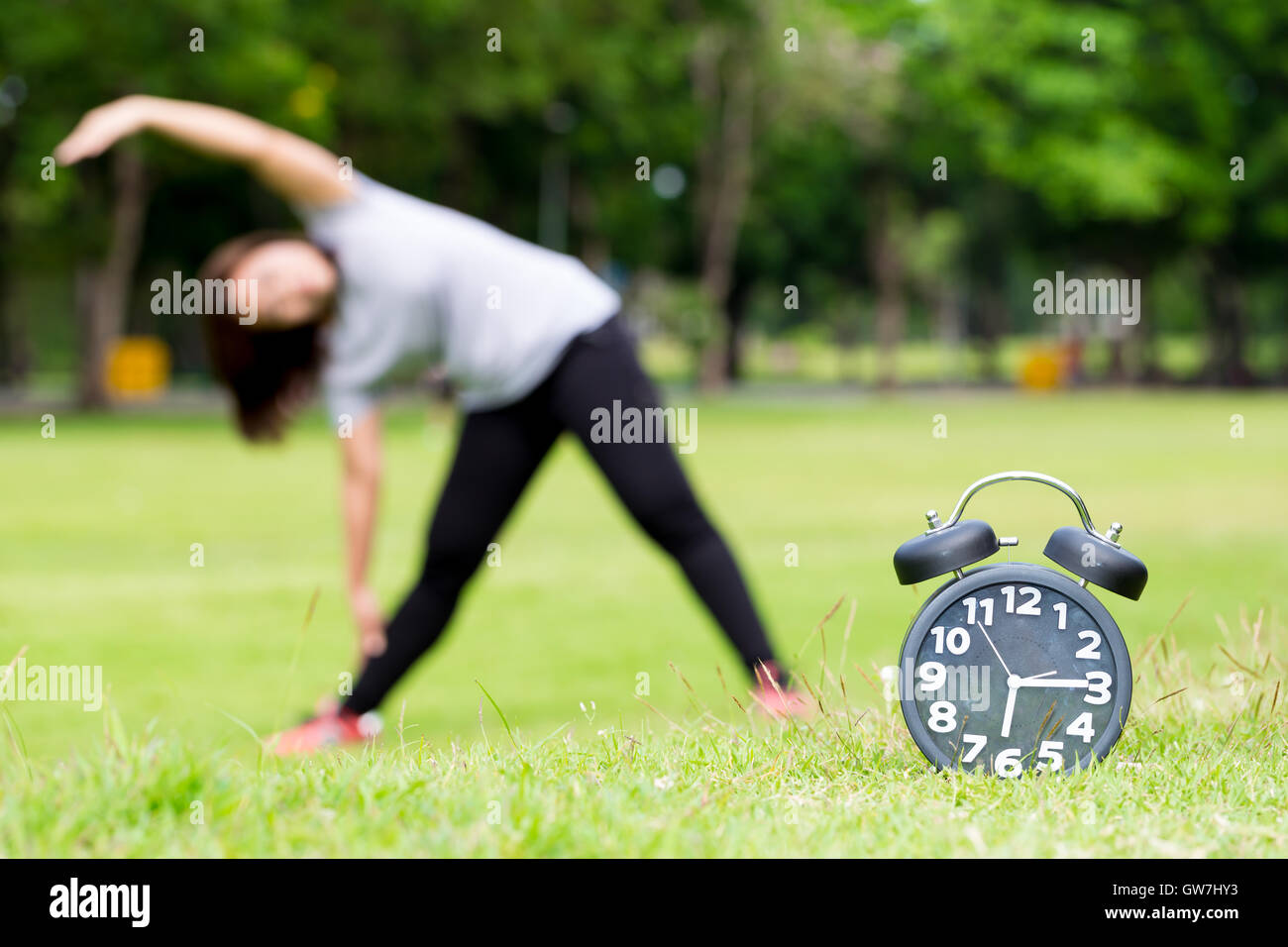 Morning exercise and black clock Stock Photo - Alamy