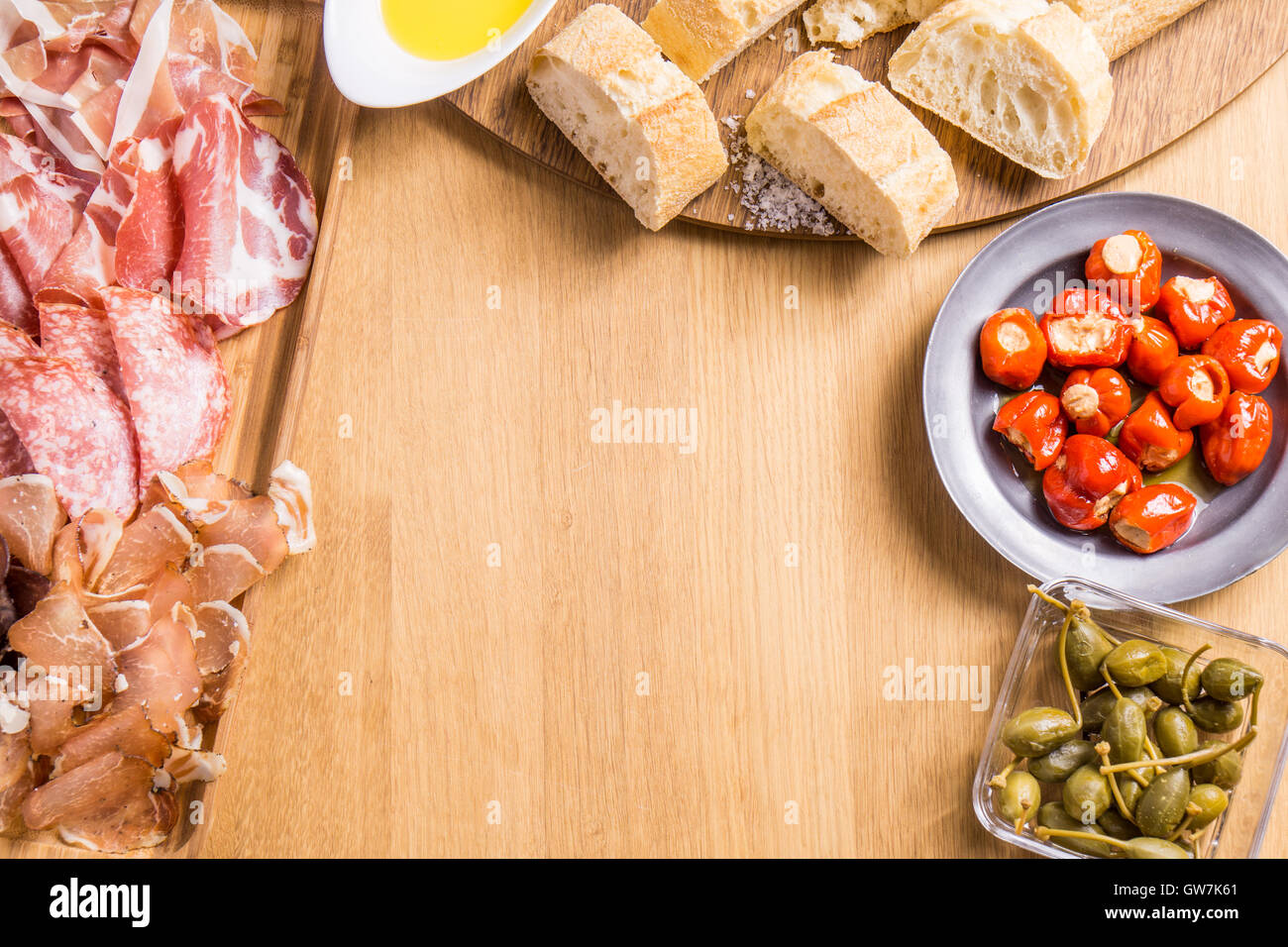 Tapas food, served in small bowls cold meat, goat cheese. A meal for ...